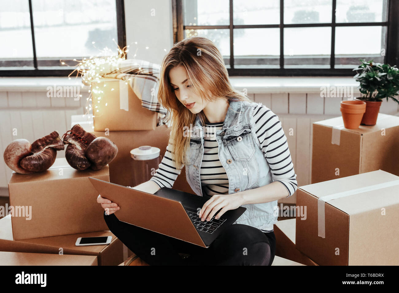 Girl is moving to new home Stock Photo - Alamy
