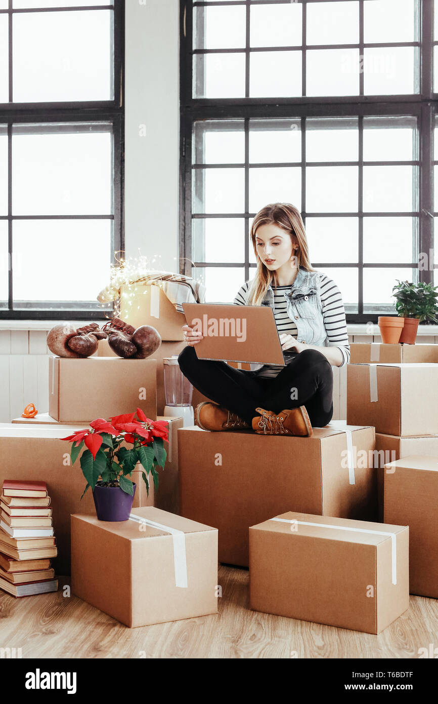 Girl is moving to new home Stock Photo - Alamy
