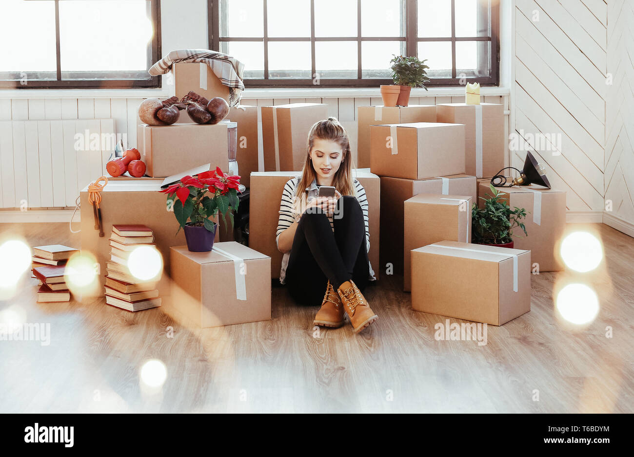 Girl is moving to new home Stock Photo - Alamy