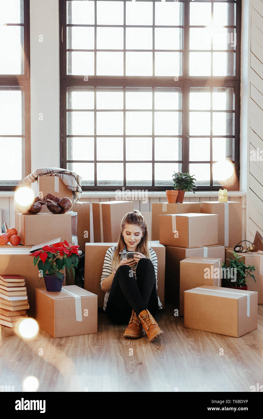 Girl is moving to new home Stock Photo - Alamy