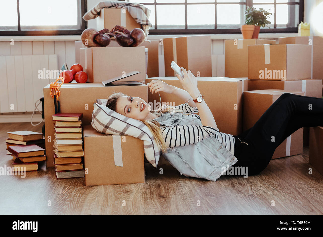 Girl is moving to new home Stock Photo - Alamy
