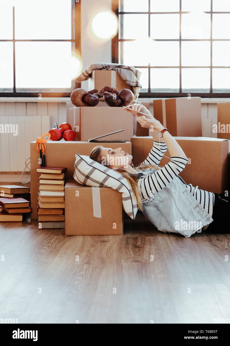 Girl is moving to new home Stock Photo - Alamy