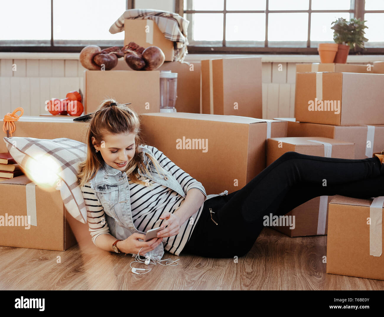 Girl is moving to new home Stock Photo - Alamy