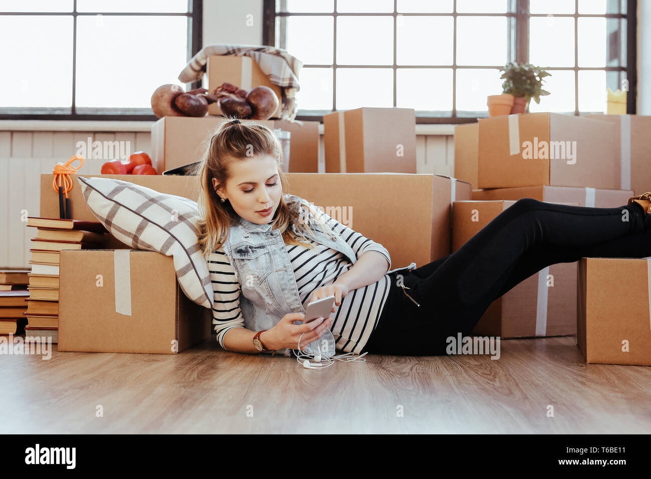 Girl is moving to new home Stock Photo - Alamy