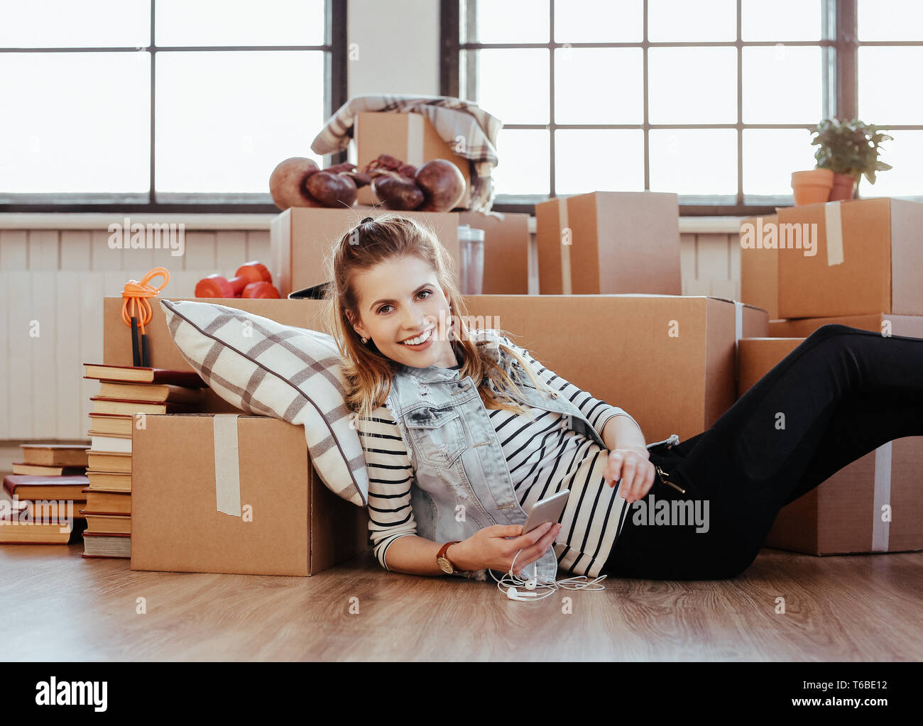 Girl is moving to new home Stock Photo - Alamy
