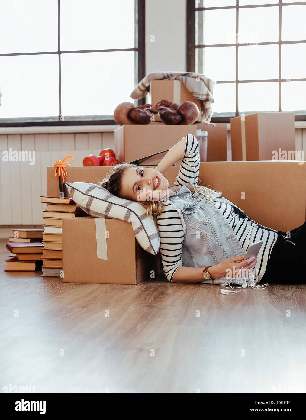Girl is moving to new home Stock Photo - Alamy