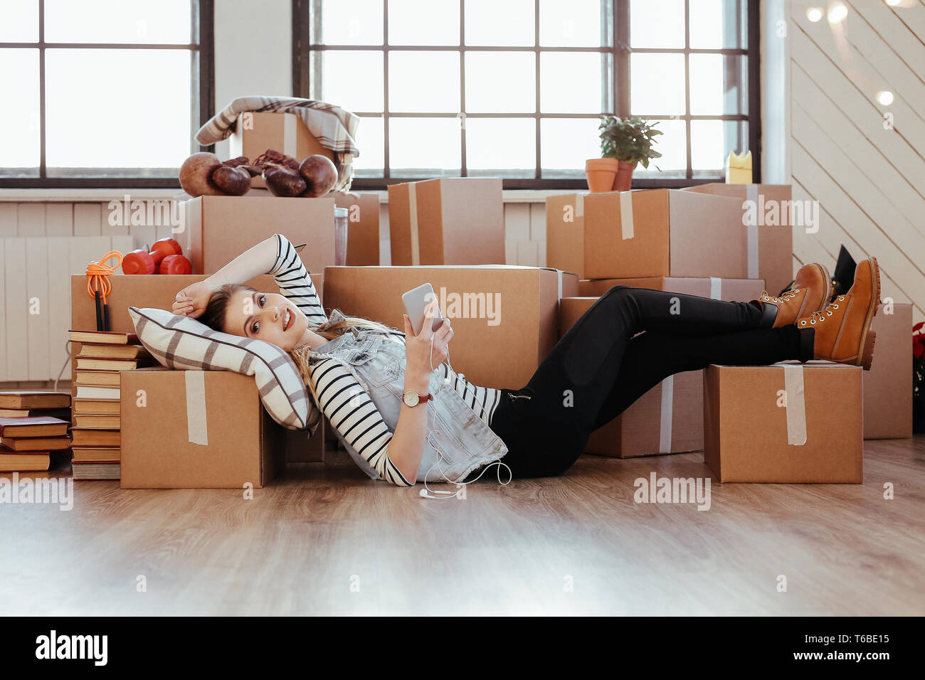 Girl is moving to new home Stock Photo - Alamy