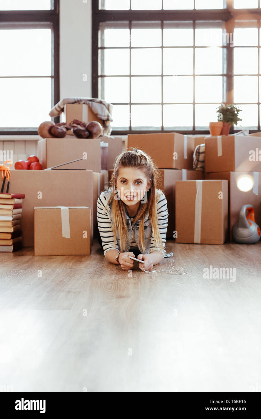 Girl is moving to new home Stock Photo - Alamy