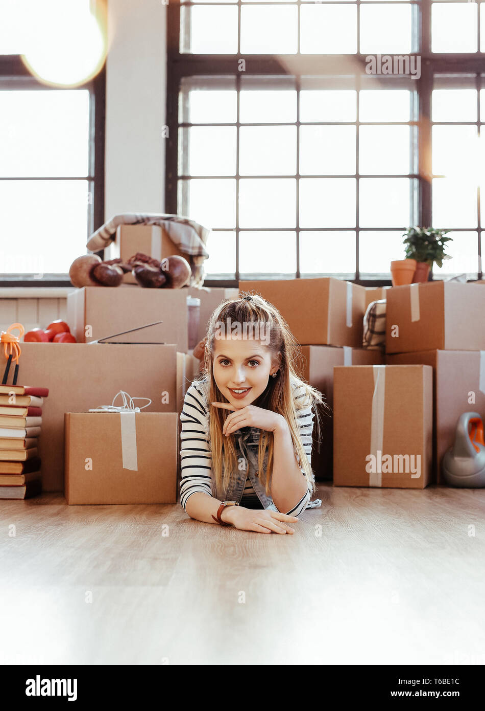 Girl is moving to new home Stock Photo - Alamy