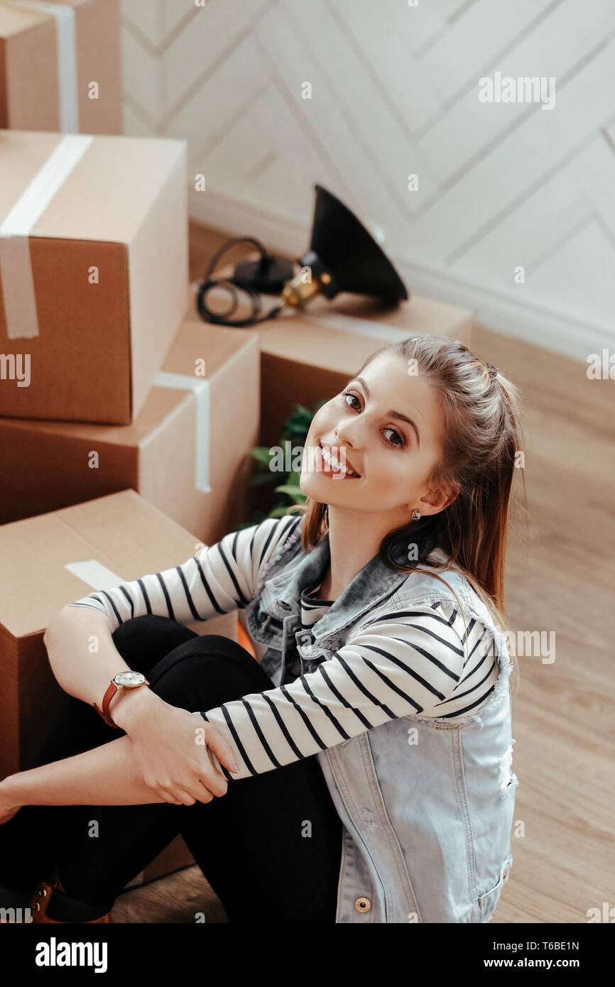 Girl is moving to new home Stock Photo - Alamy
