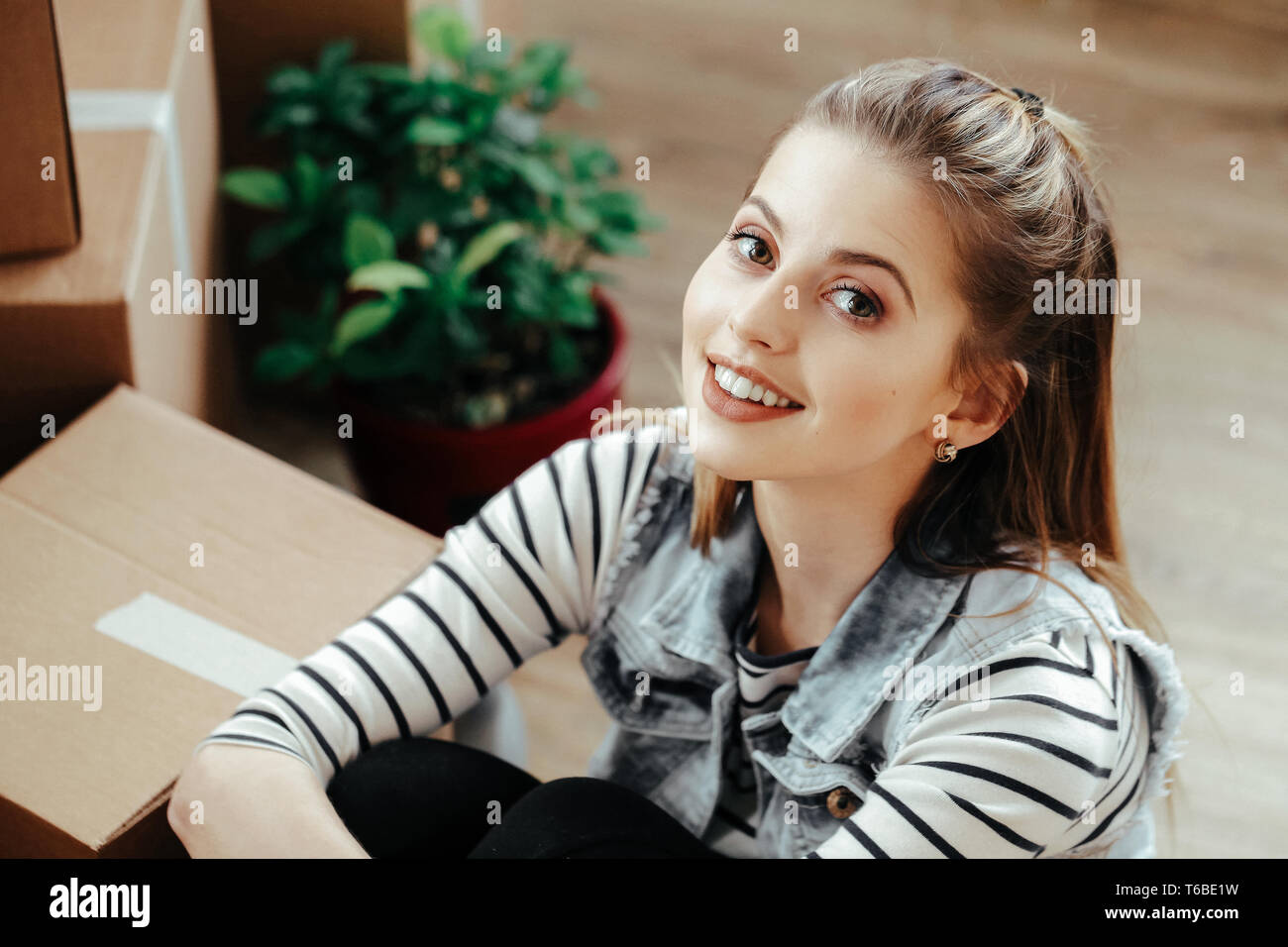 Girl is moving to new home Stock Photo - Alamy