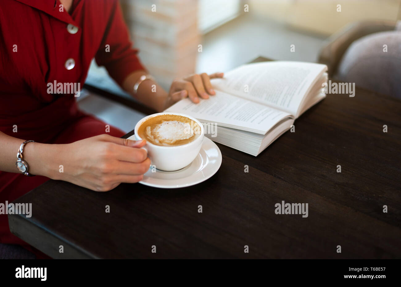 Woman reading a book in a cafe hi-res stock photography and images - Alamy