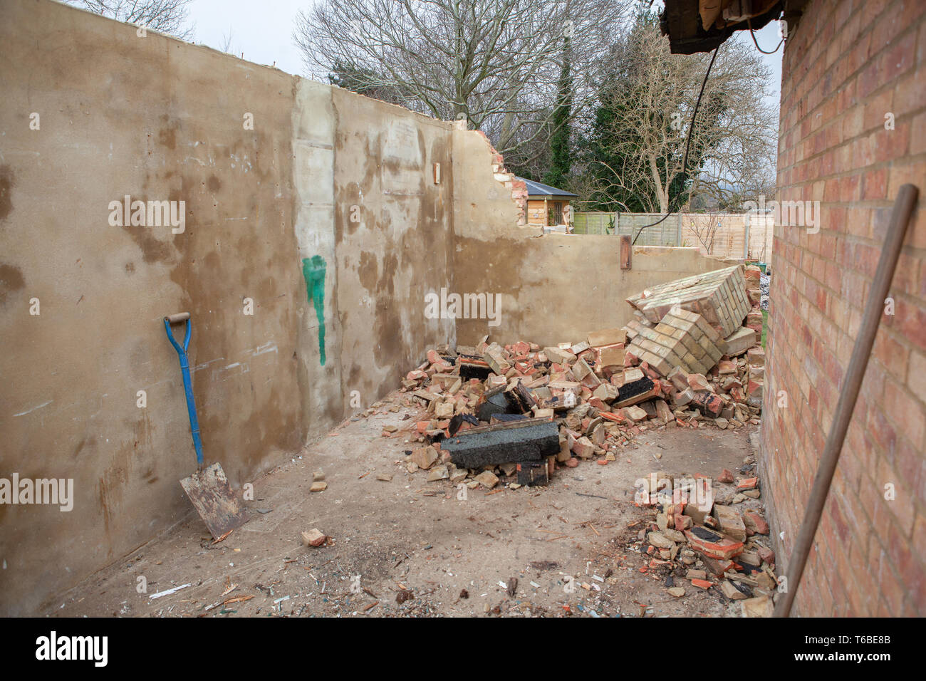 Demolition works in the residential property, destroyed garage, rubble ...