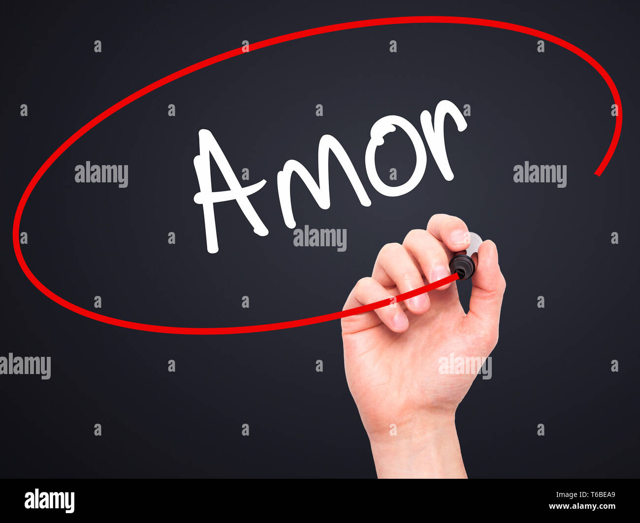 Man Hand writing Amor ( Love in Portuguese)with black marker on visual ...