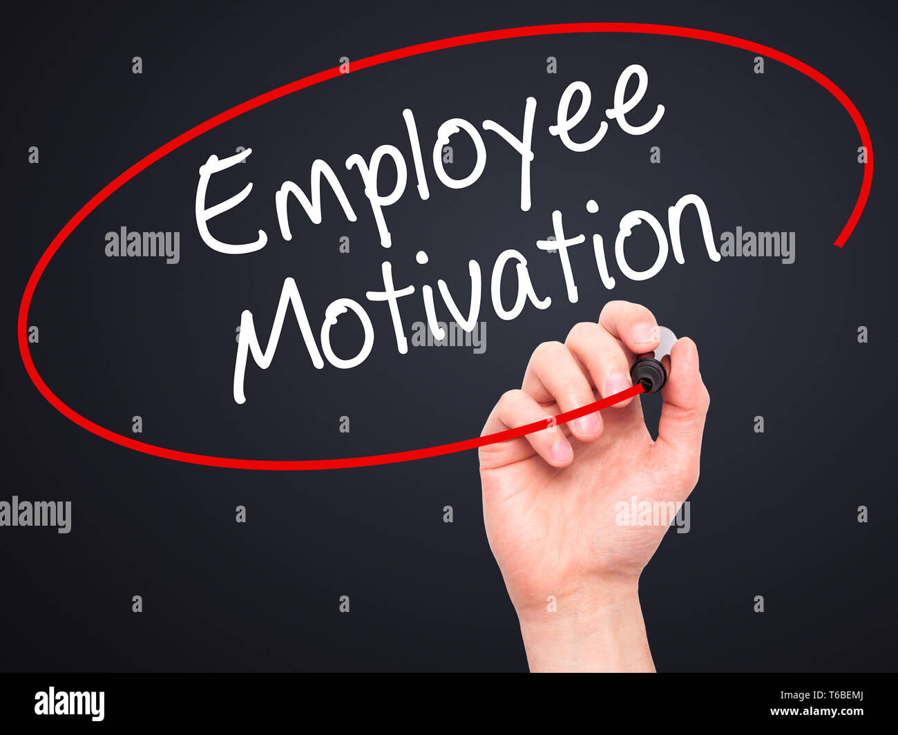 Man Hand writing Employee Motivation with black marker on visual screen ...