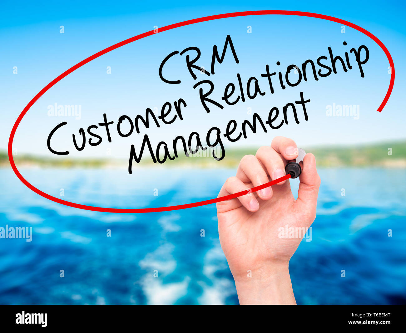 Man Hand writing CRM Customer Relationship Management with black marker ...