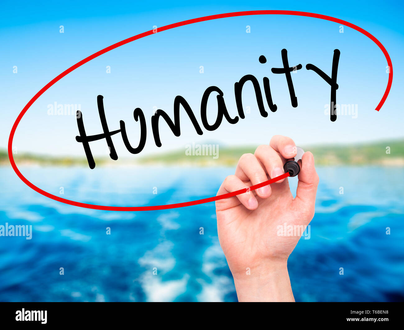 Man Hand writing Humanity with black marker on visual screen Stock ...