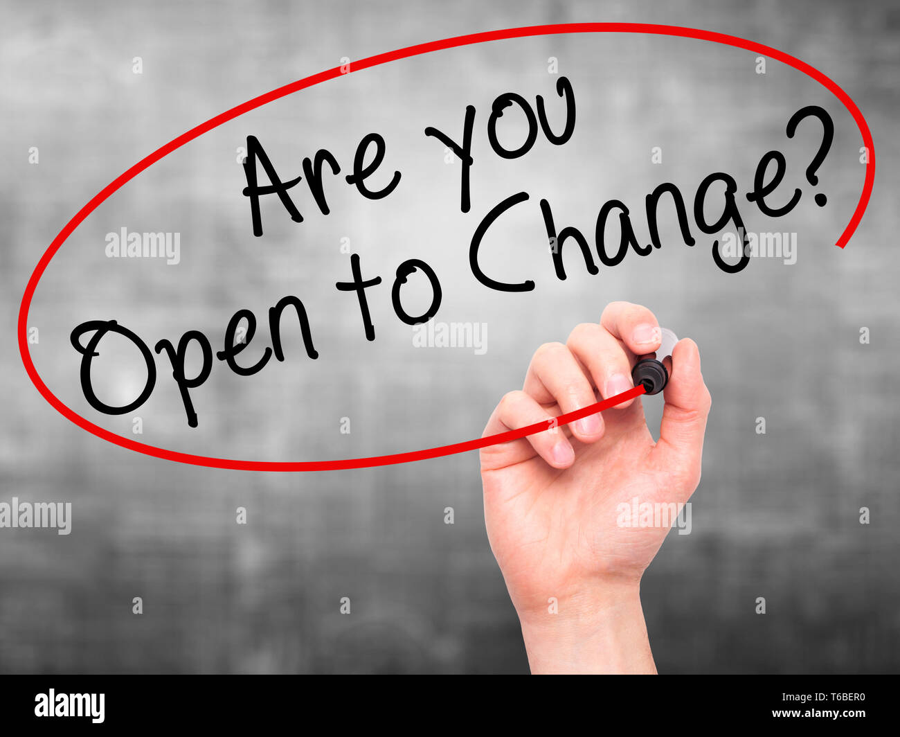 Man Hand writing Are you Open to Change? with black marker on visual ...