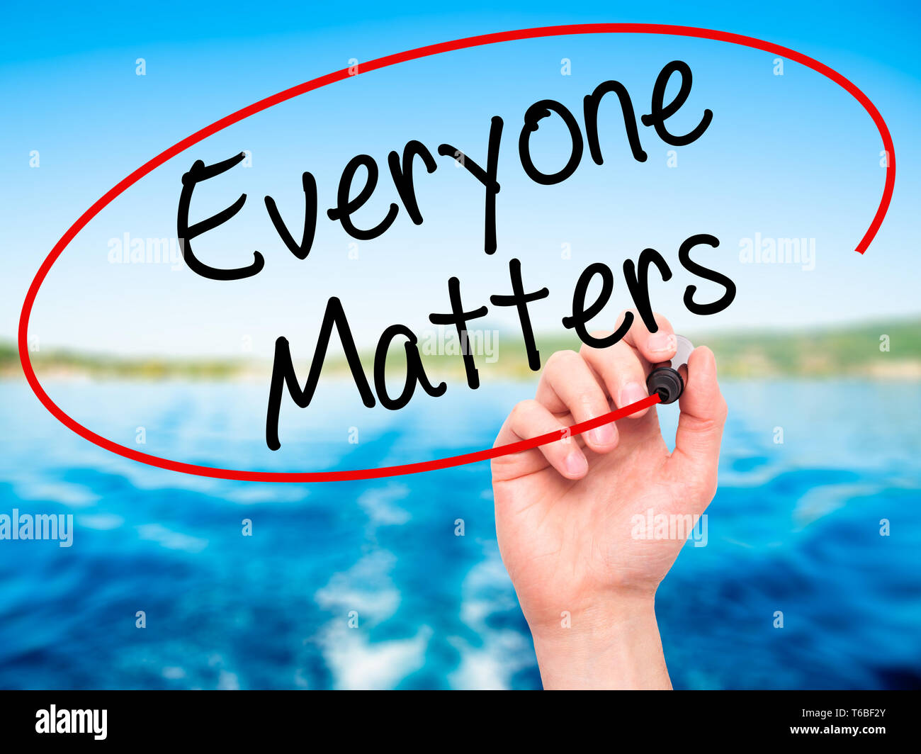 Man Hand writing Everyone Matters with black marker on visual screen ...