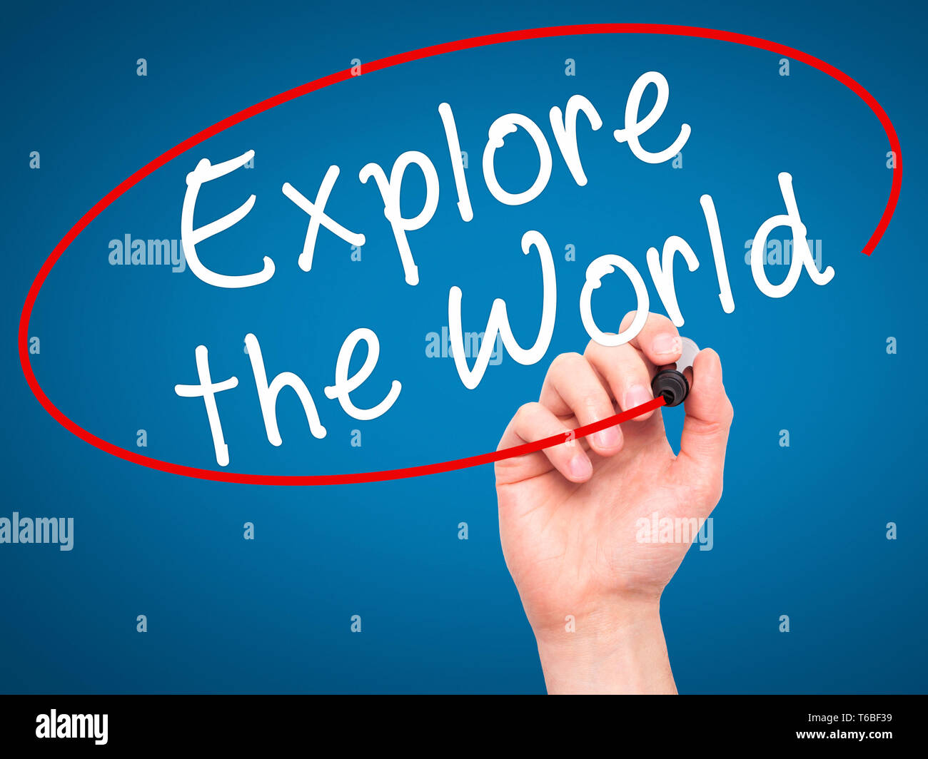 Man Hand writing Explore the World with black marker on visual screen ...