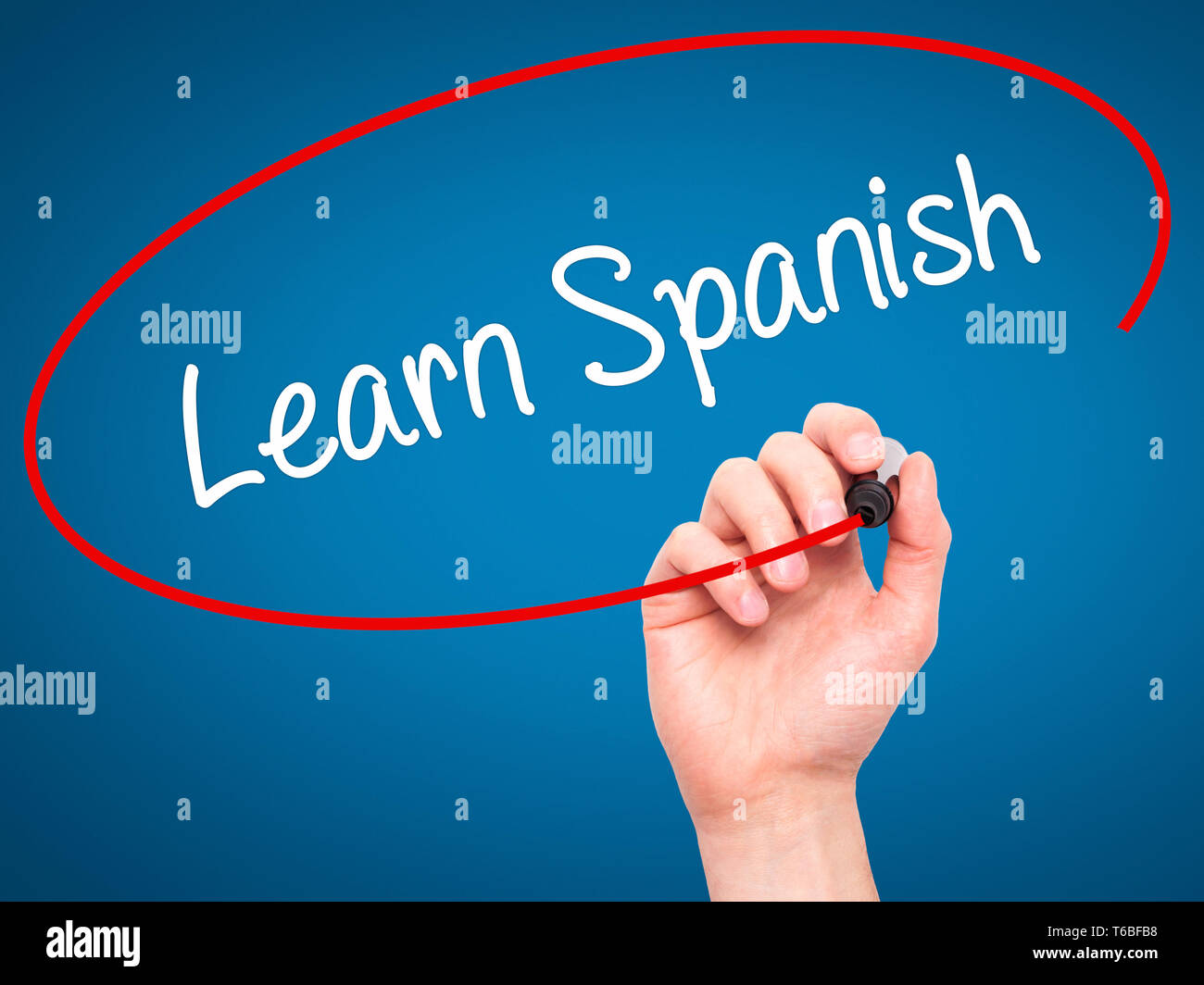 Man Hand writing Learn Spanish with black marker on visual screen Stock ...