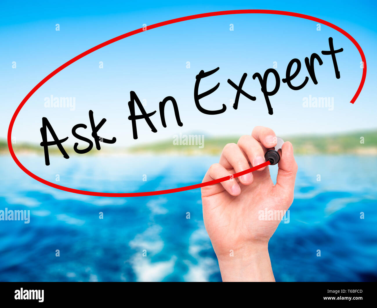 Man Hand writing Ask An Expert with black marker on visual screen Stock ...