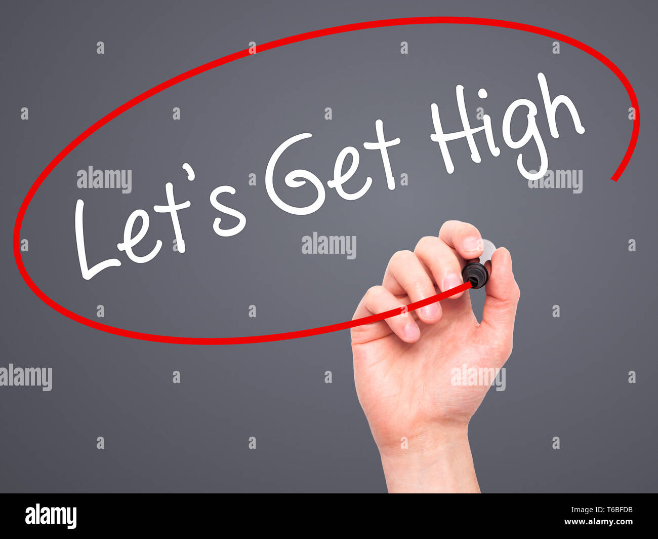 Man Hand writing Let's Get High with black marker on visual screen ...