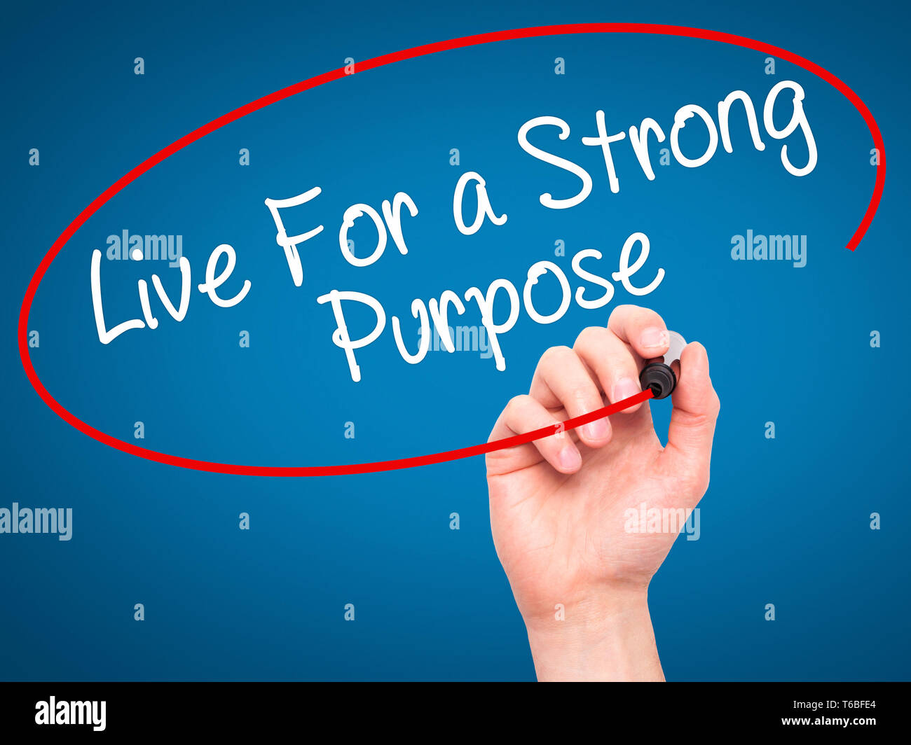 Man Hand writing Live For a Strong Purpose with black marker on visual ...