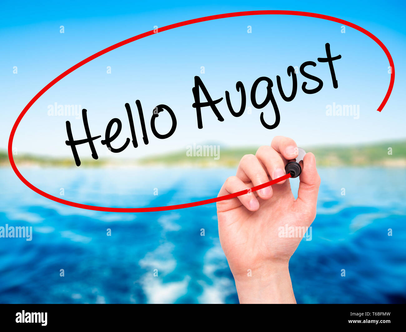 Man Hand writing Hello August with black marker on visual screen Stock ...