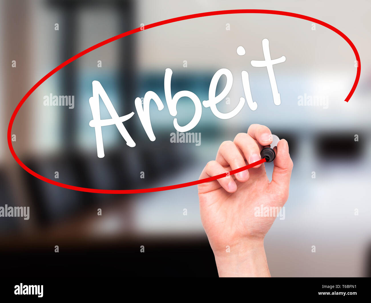 Man Hand writing Arbeit (Work in German) with black marker on visual ...