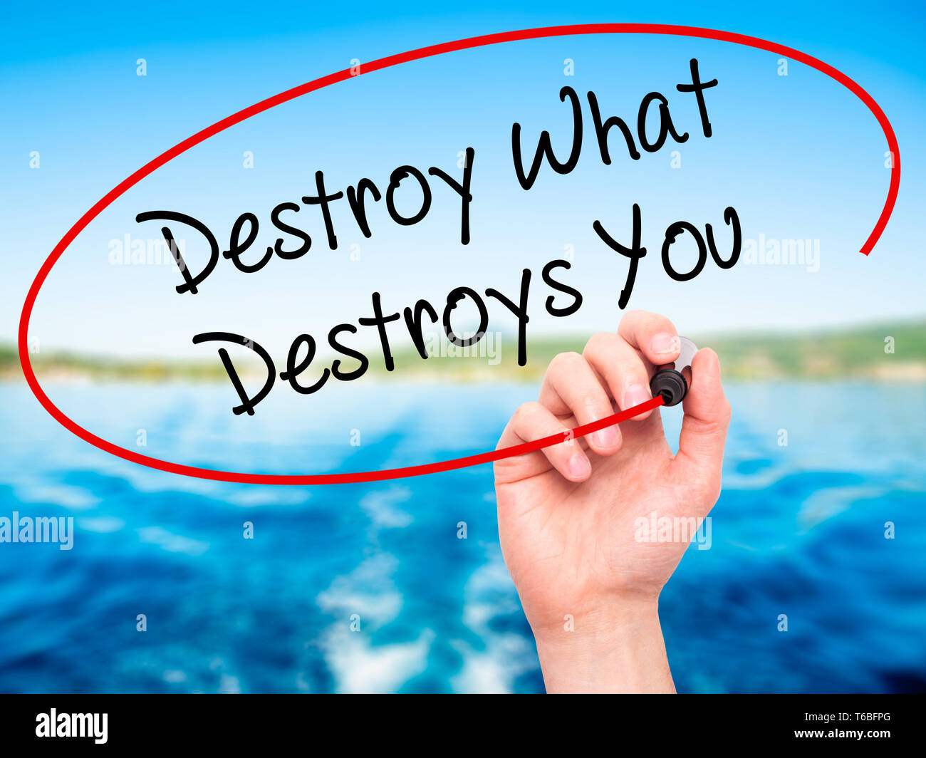 Man Hand writing Destroy What Destroys You with black marker on visual ...