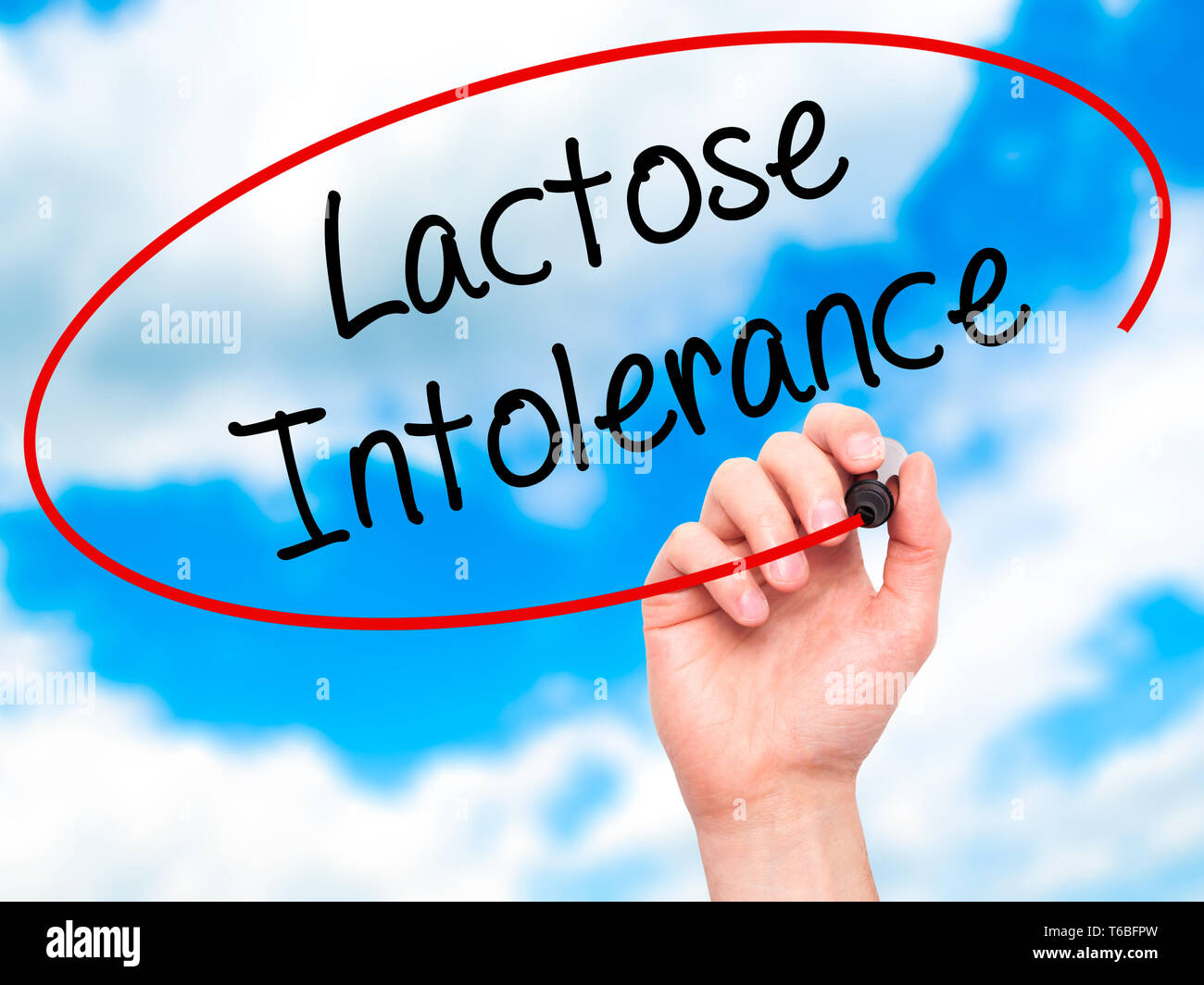 Man Hand writing Lactose Intolerance with black marker on visual screen ...