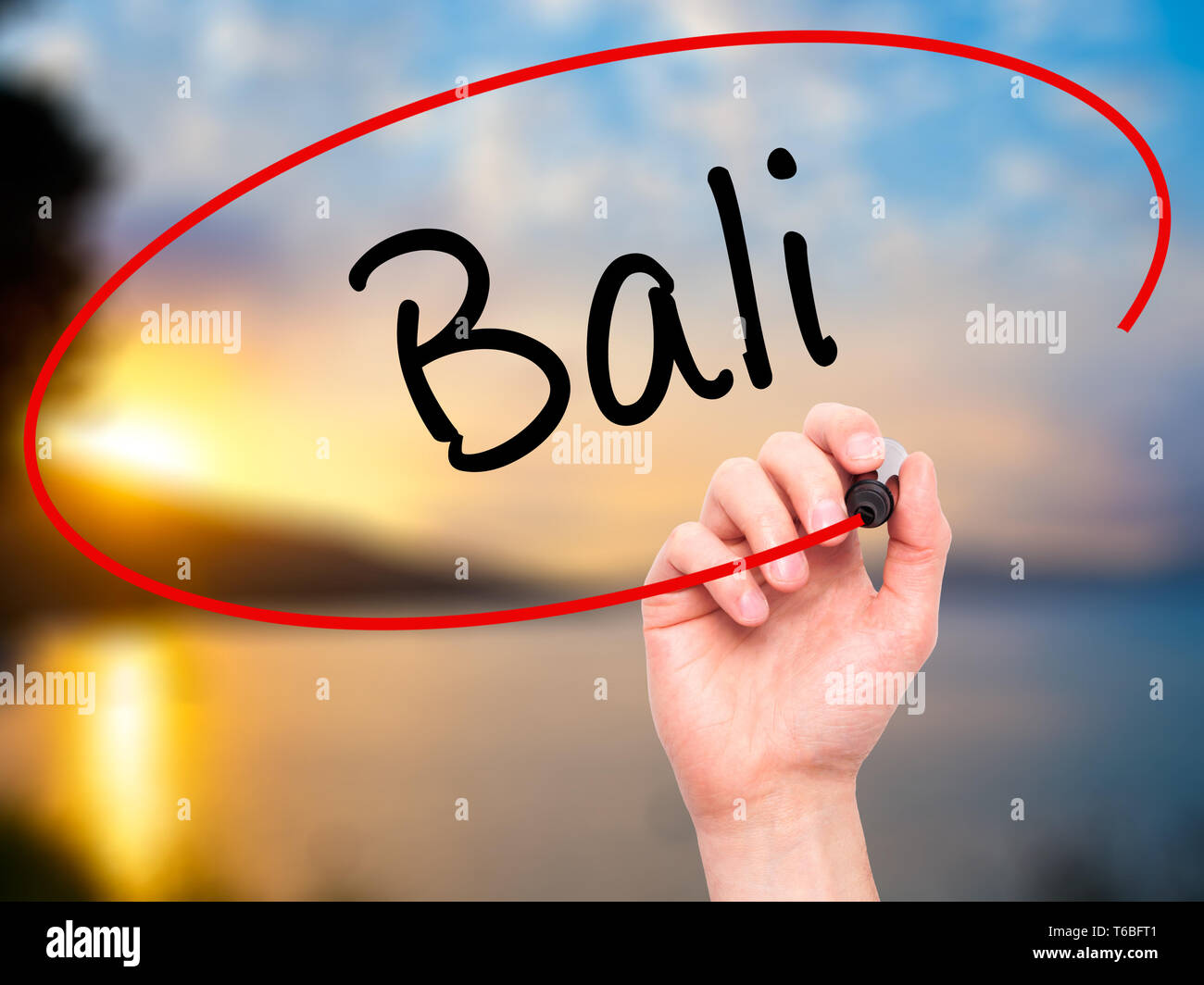 Man Hand writing Bali with black marker on visual screen Stock Photo ...