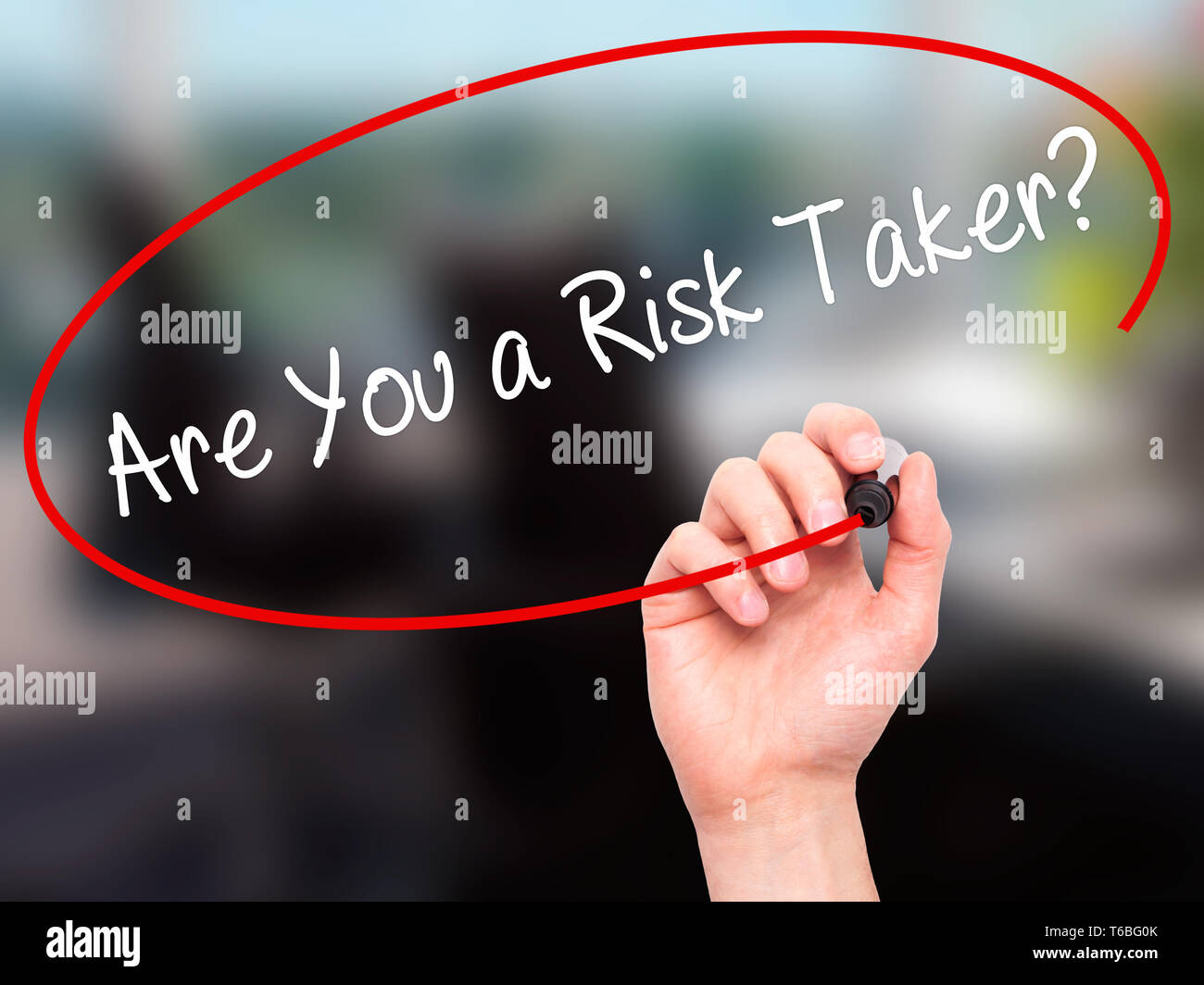 Man Hand writing Are You a Risk Taker? with black marker on visual ...