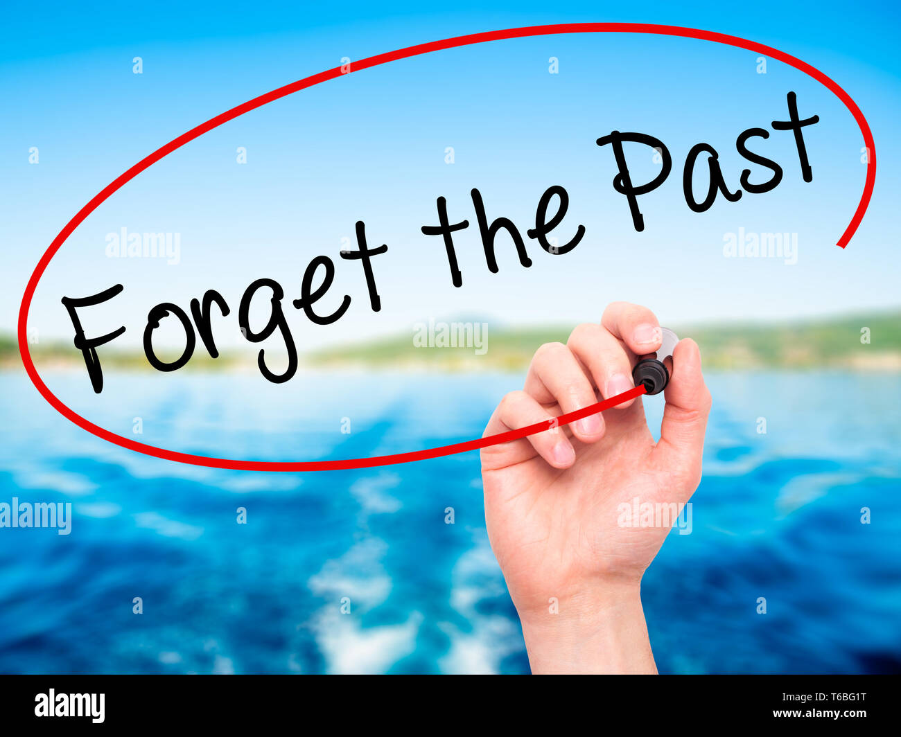 Man Hand writing Forget the Past with black marker on visual screen ...