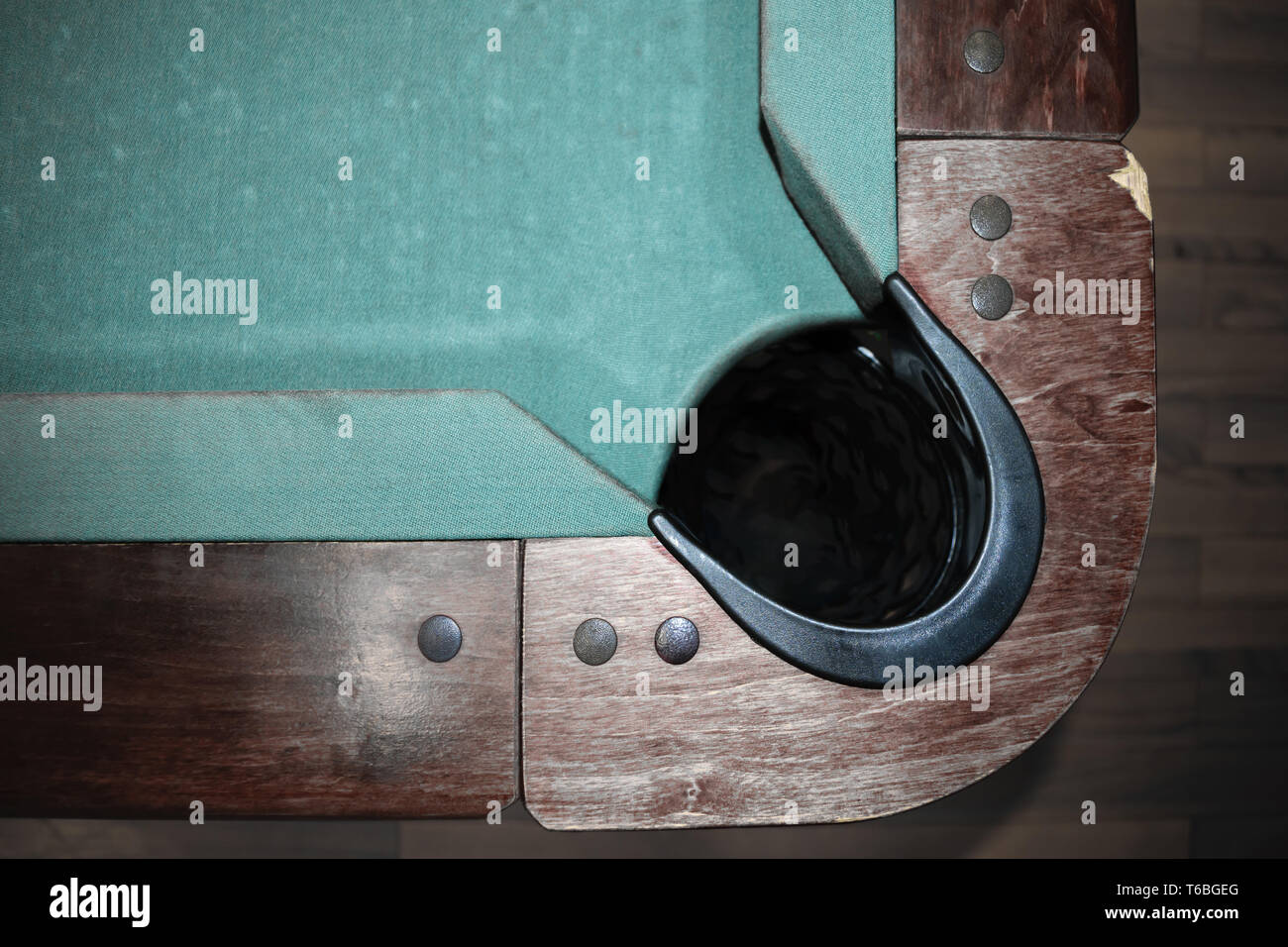 Very old part of green with wooden edges and black ball hole pool table ...