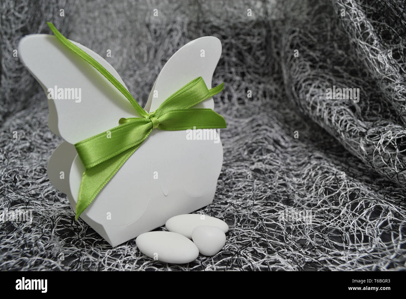 Butterfly shaped box with almond confetti inside Stock Photo - Alamy