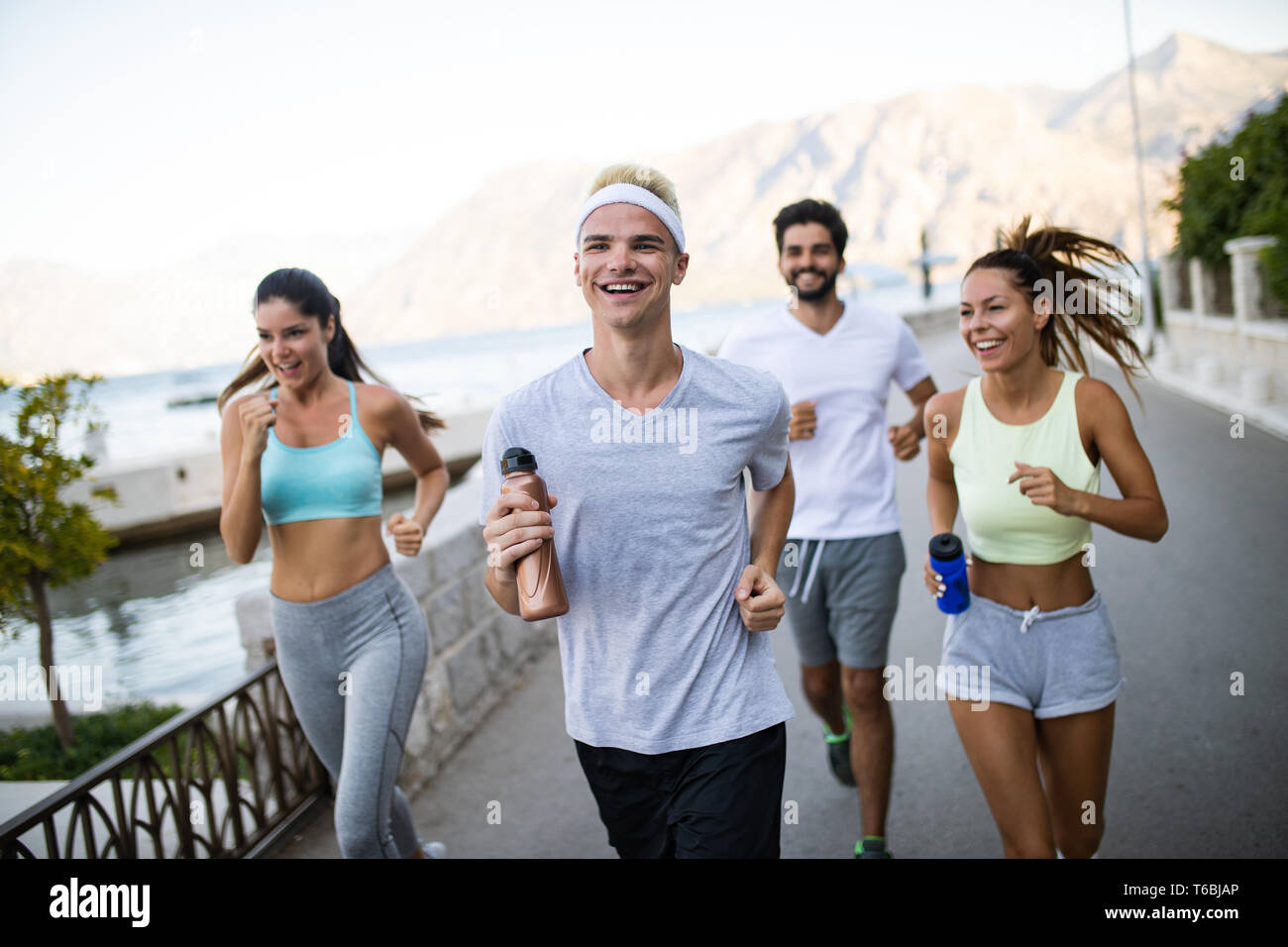 Group people running hi-res stock photography and images - Alamy