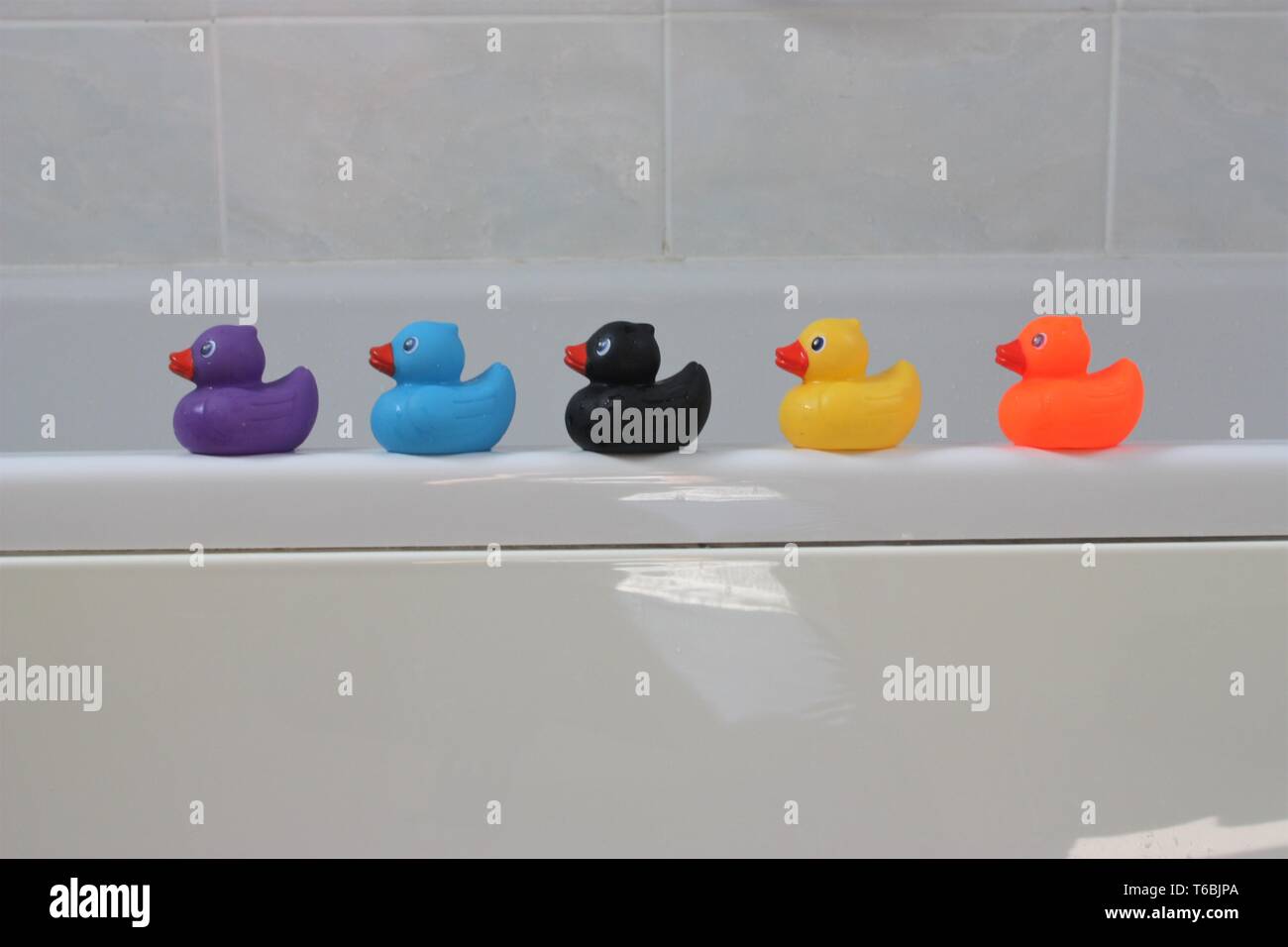 Colourful bathroom rubber ducks Stock Photo - Alamy