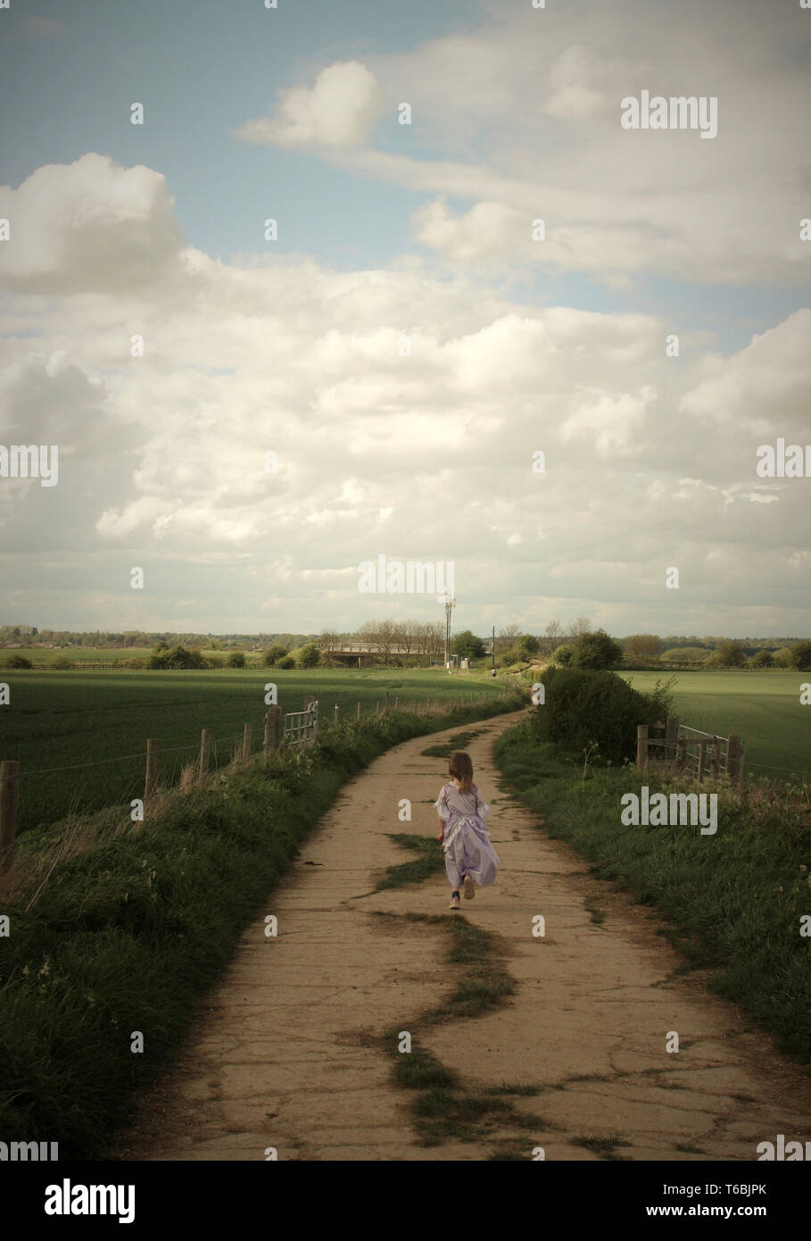 Girl walking down a path hi-res stock photography and images - Alamy