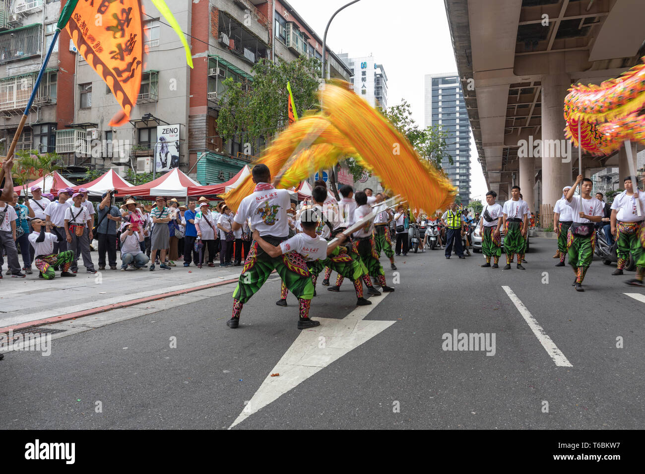 A dance troupe performs the dragon dance during a Matsu procession ...