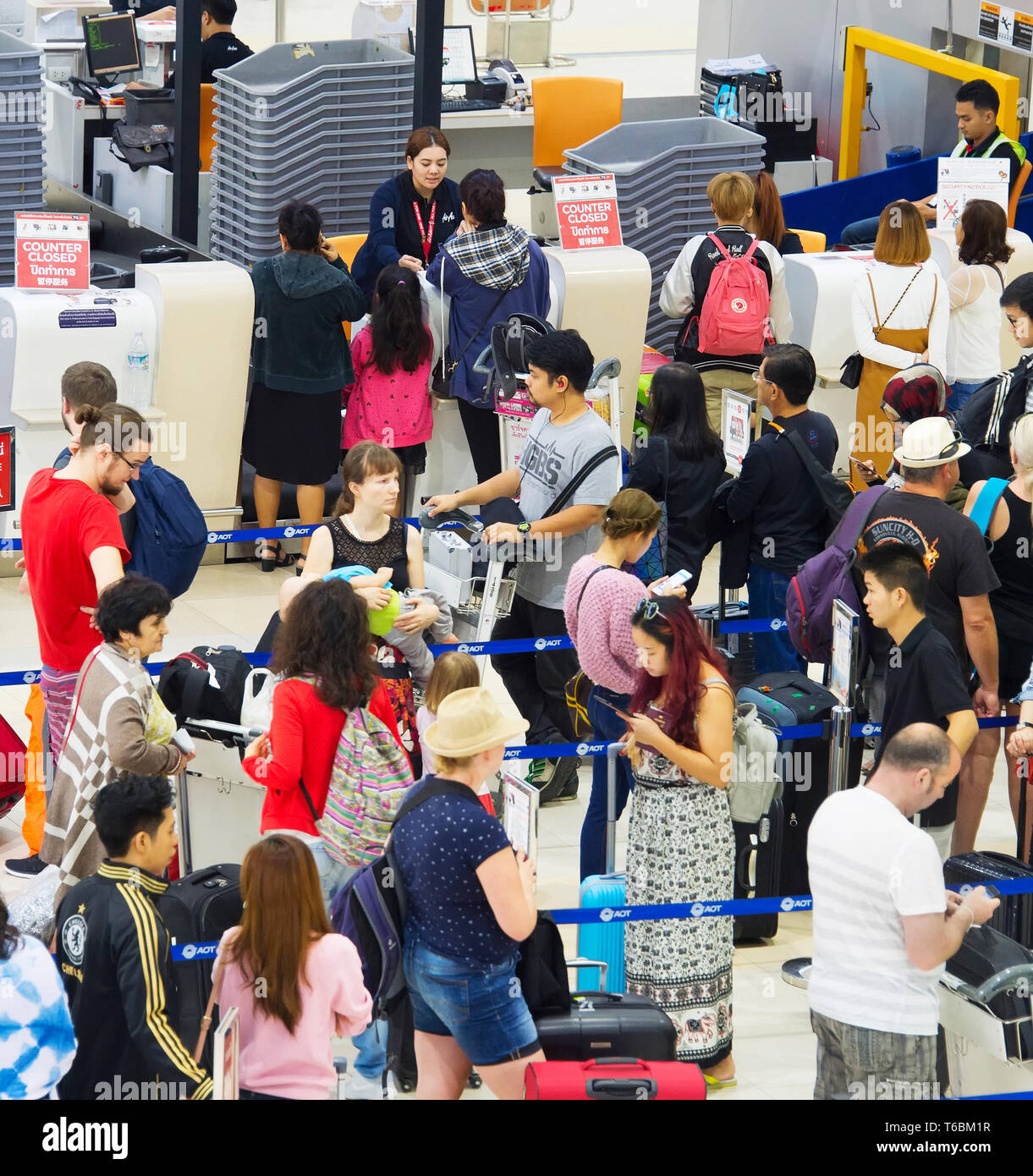 Check-in busy line at airport Stock Photo - Alamy