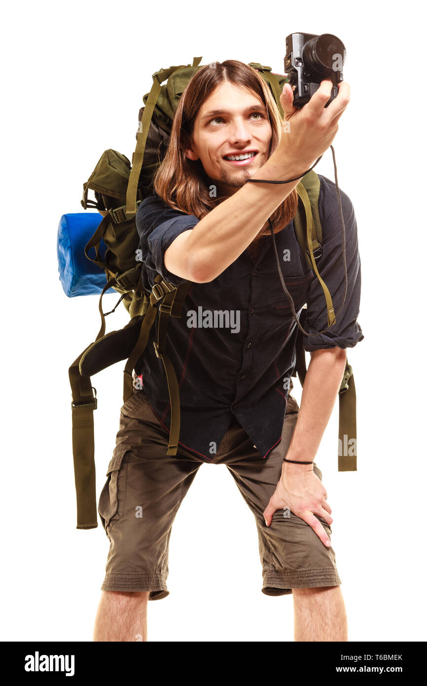 Man tourist backpacker taking photo picture with camera. Young guy ...