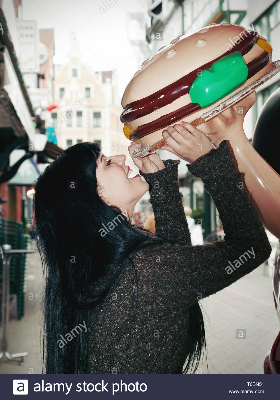 Biting Into Hamburger Stock Photos & Biting Into Hamburger Stock Images ...