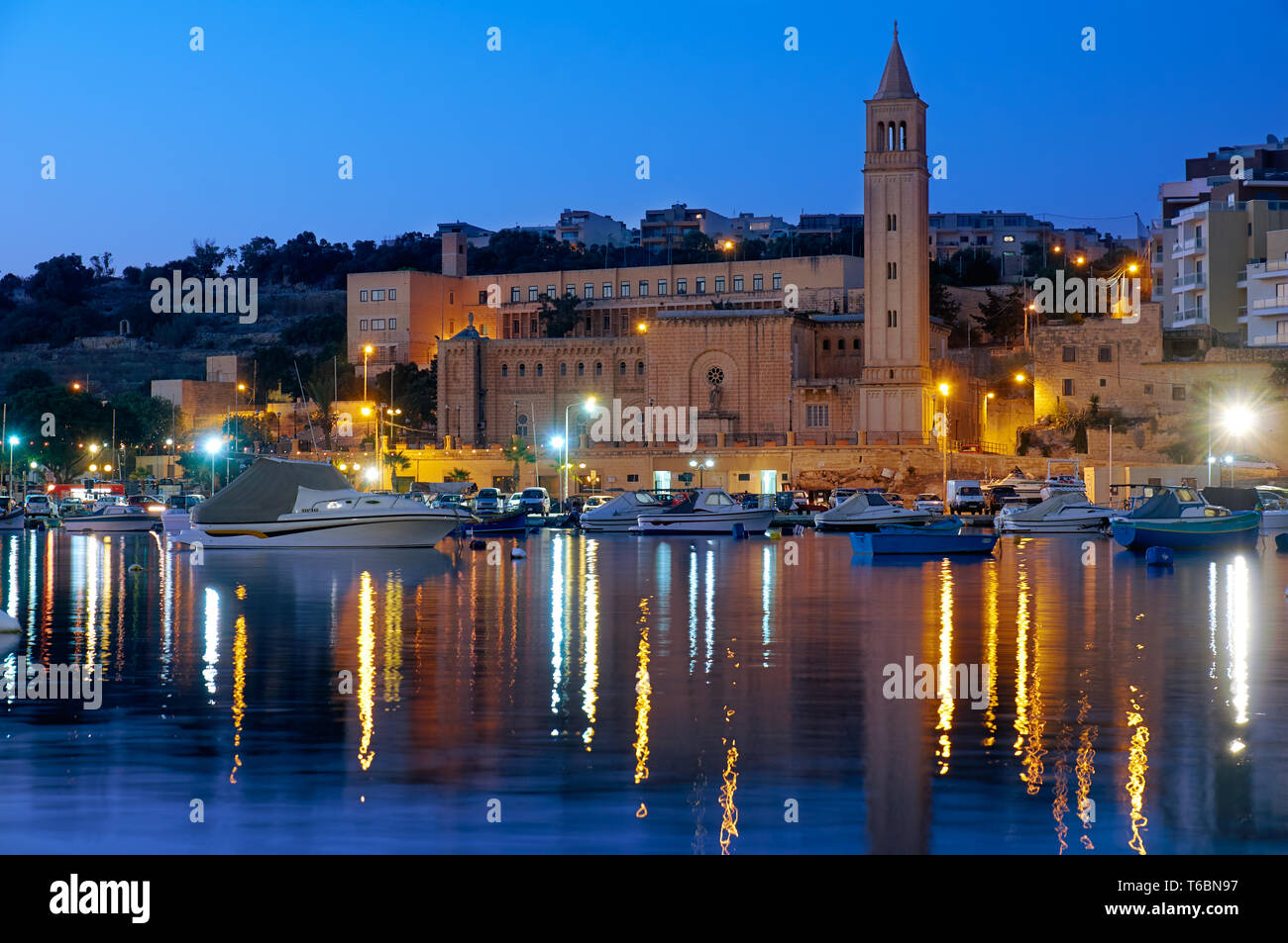 The night view of parish church of St. Anna over the Marsaskala Creeky ...