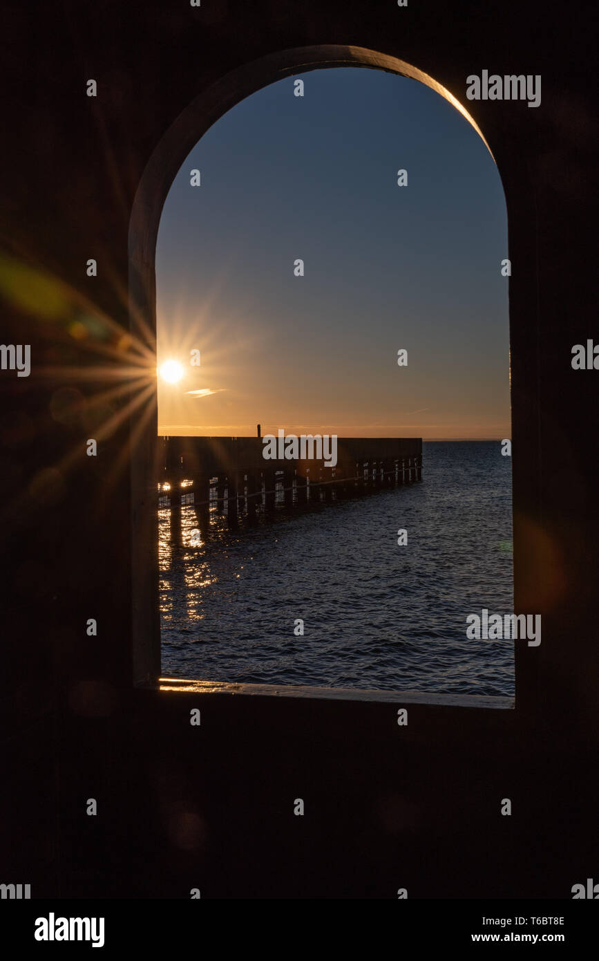 Sunset through a window near a pier Brighton Beach, Victoria, Australia ...