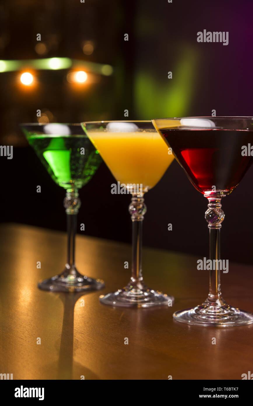 Three exotic cocktails in bar Stock Photo - Alamy