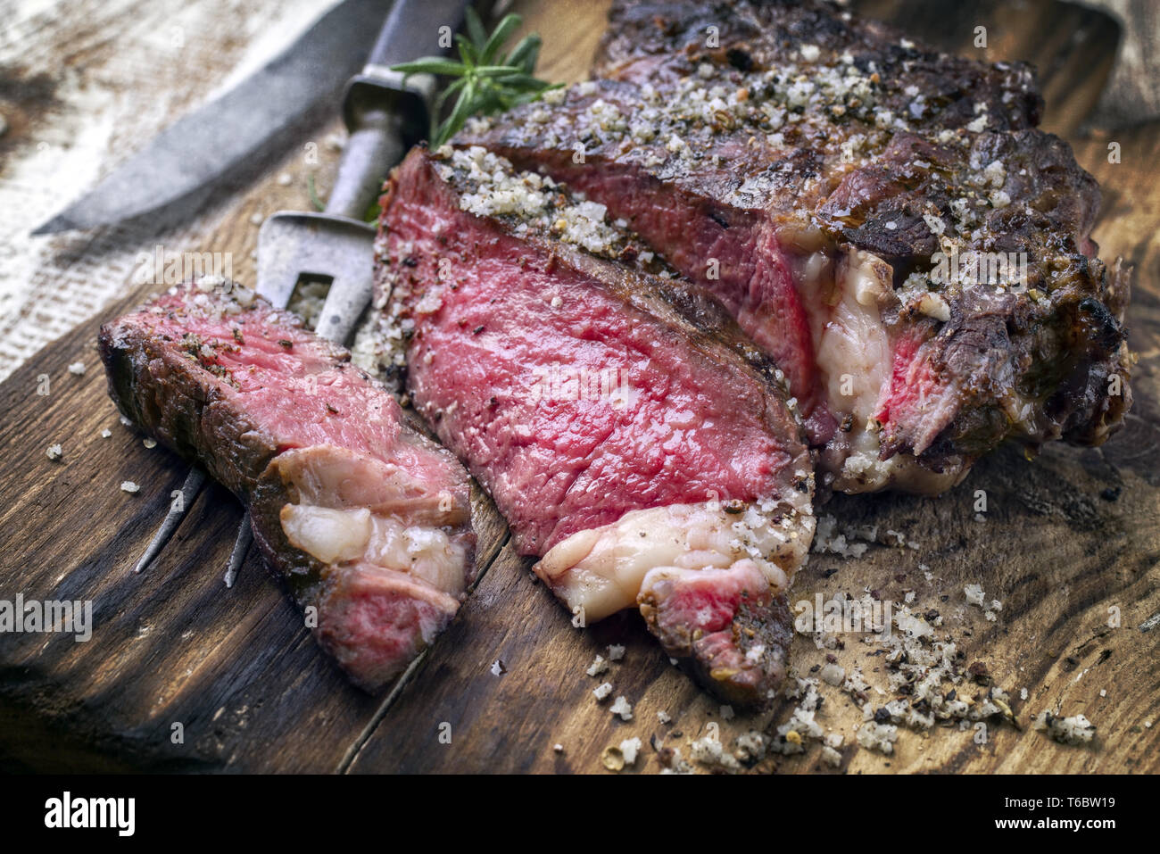 Barbecue dry aged Kobe Tomahawk Steak as close-up on a cutting board ...
