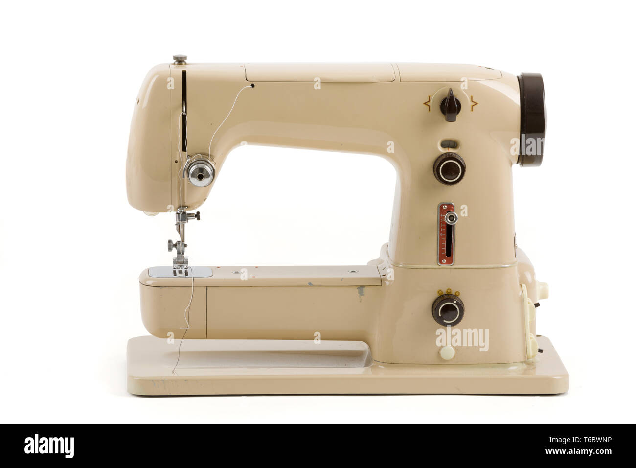 Old vintage sewing machine isolated on white Stock Photo - Alamy