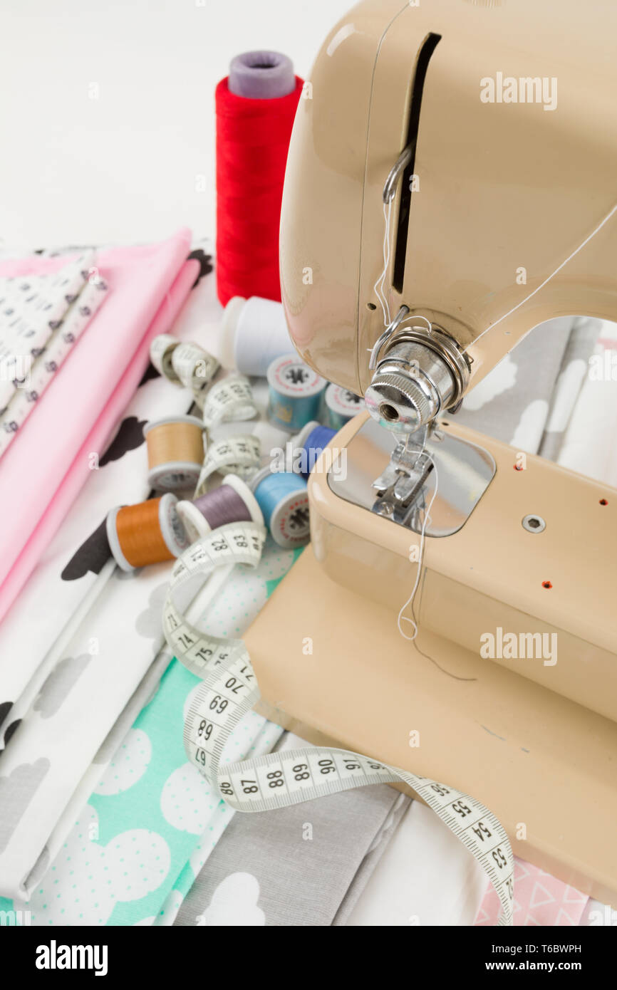 Sewing machine, fabric and measurement tape Stock Photo - Alamy